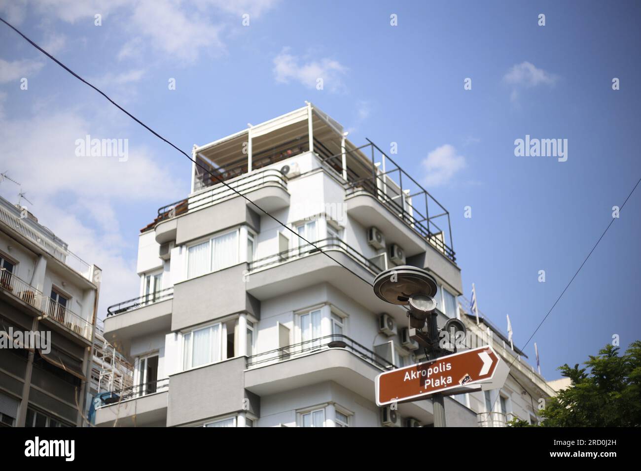 Akropolis signal in a urban district with residential houses in Athens ...