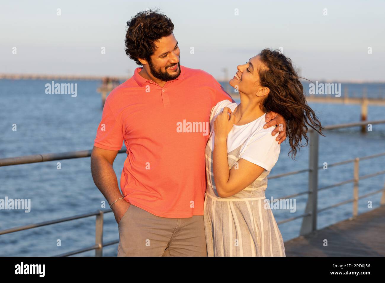 Smiling european millennial couple hugging, enjoy walk and romantic ...