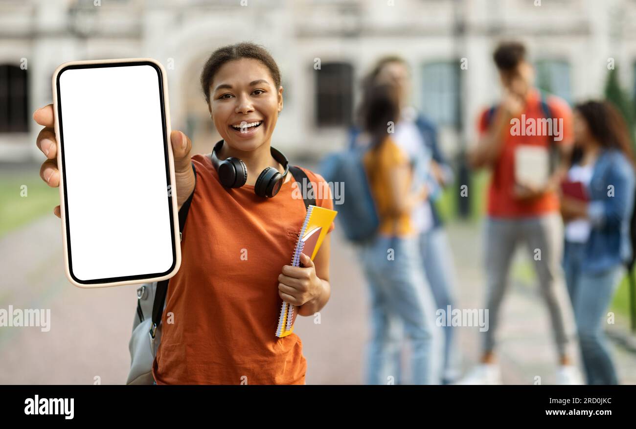 Happy Black Female Student Showing Big Blank Smartphone While Standing ...