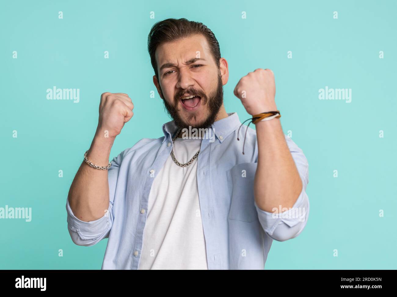 Happy joyful lebanese man shouting, celebrating success, winning ...