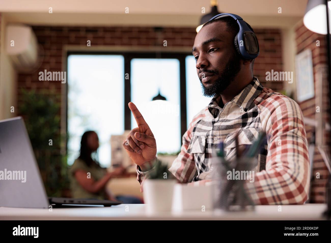 Student raising hand in computer hi-res stock photography and images ...