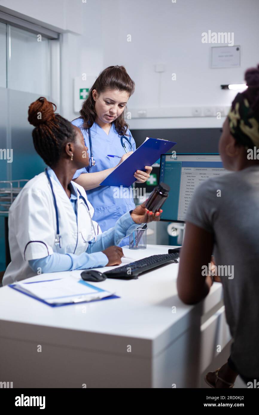 Doctor prescribing medicine during medical hi-res stock photography and ...