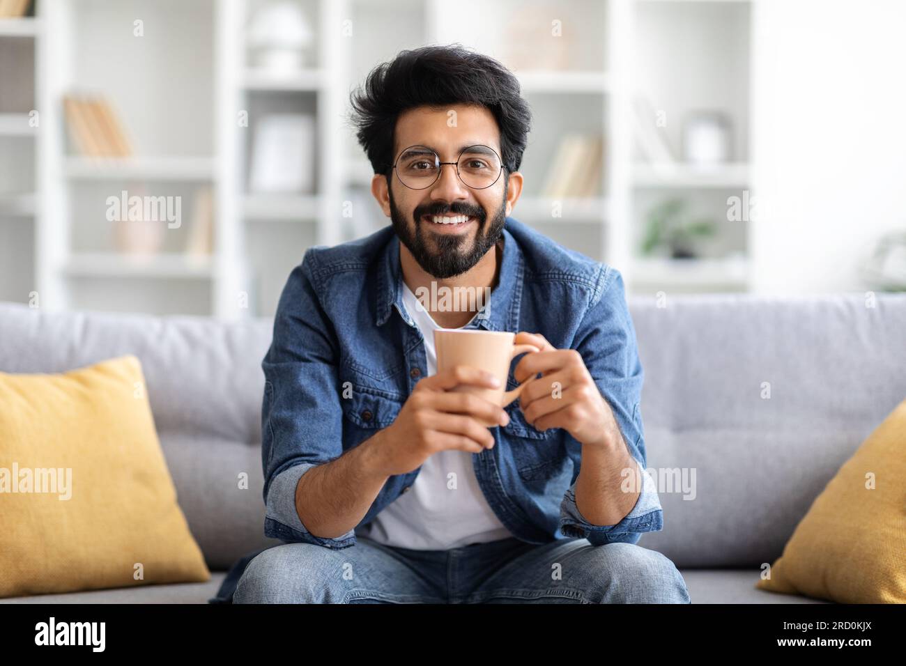 Happy Indian Man Holding Cup Of Coffee And Smiling To Camera Stock ...