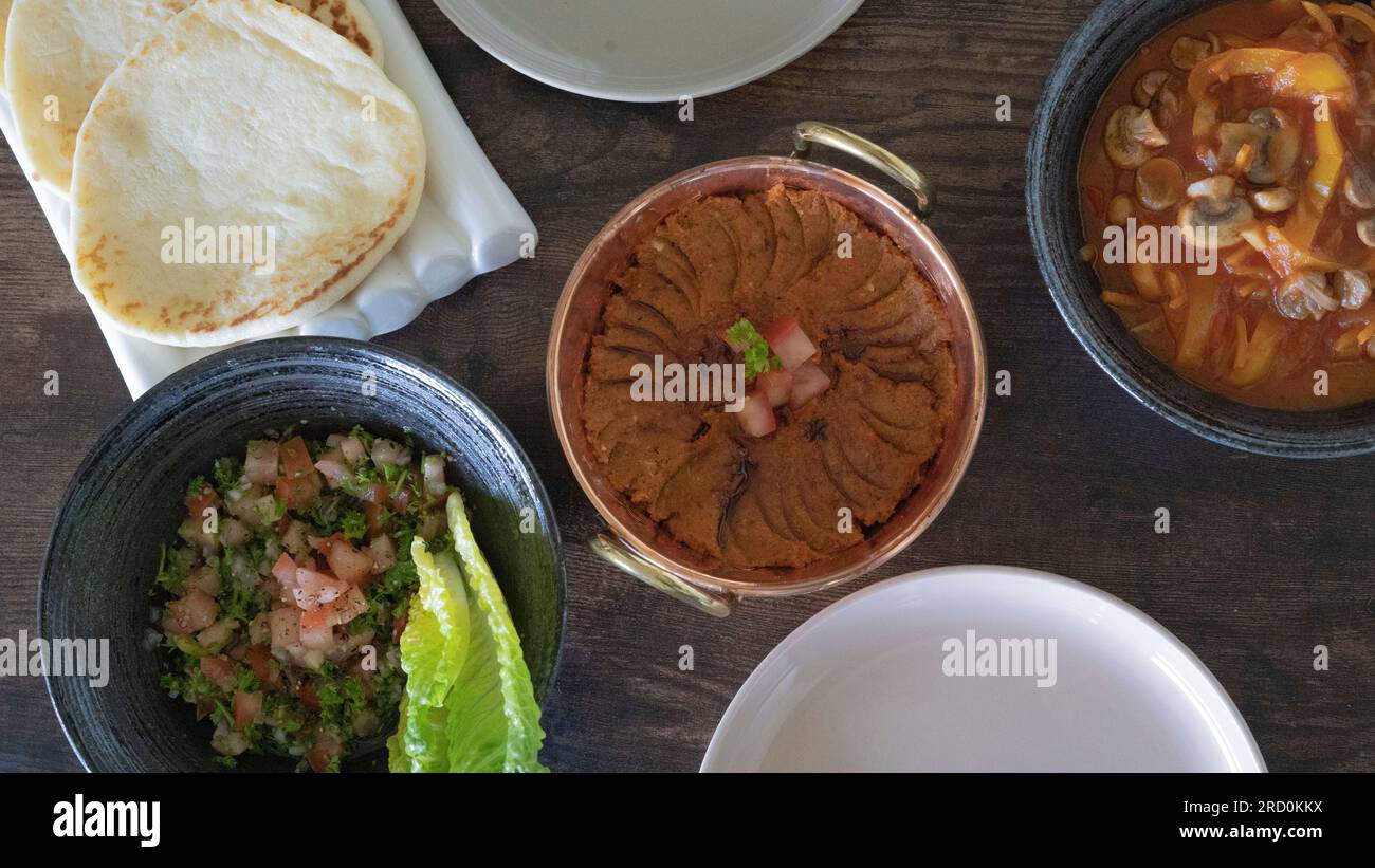 Middle eastern appetizers set of tabouleh, mhamara, mushroom mix, and ...