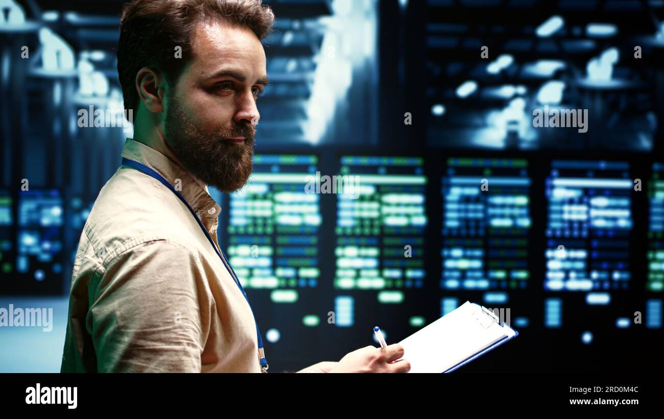 Meticulous technician doing checkup on interlinked computers creating ...