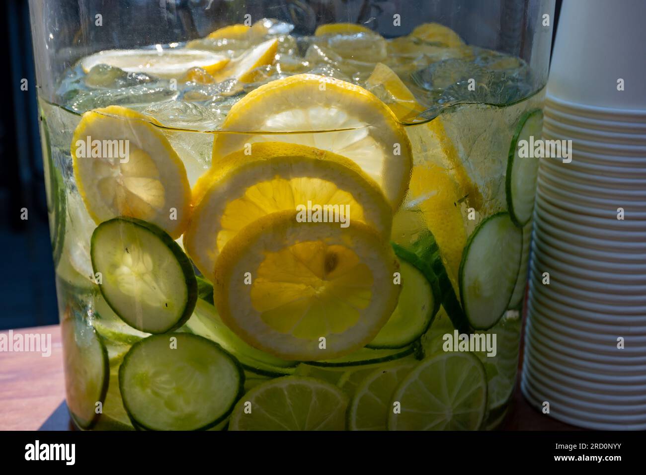 Big glass glass jar with tap filled with fresh healthy lemon lemonade ...