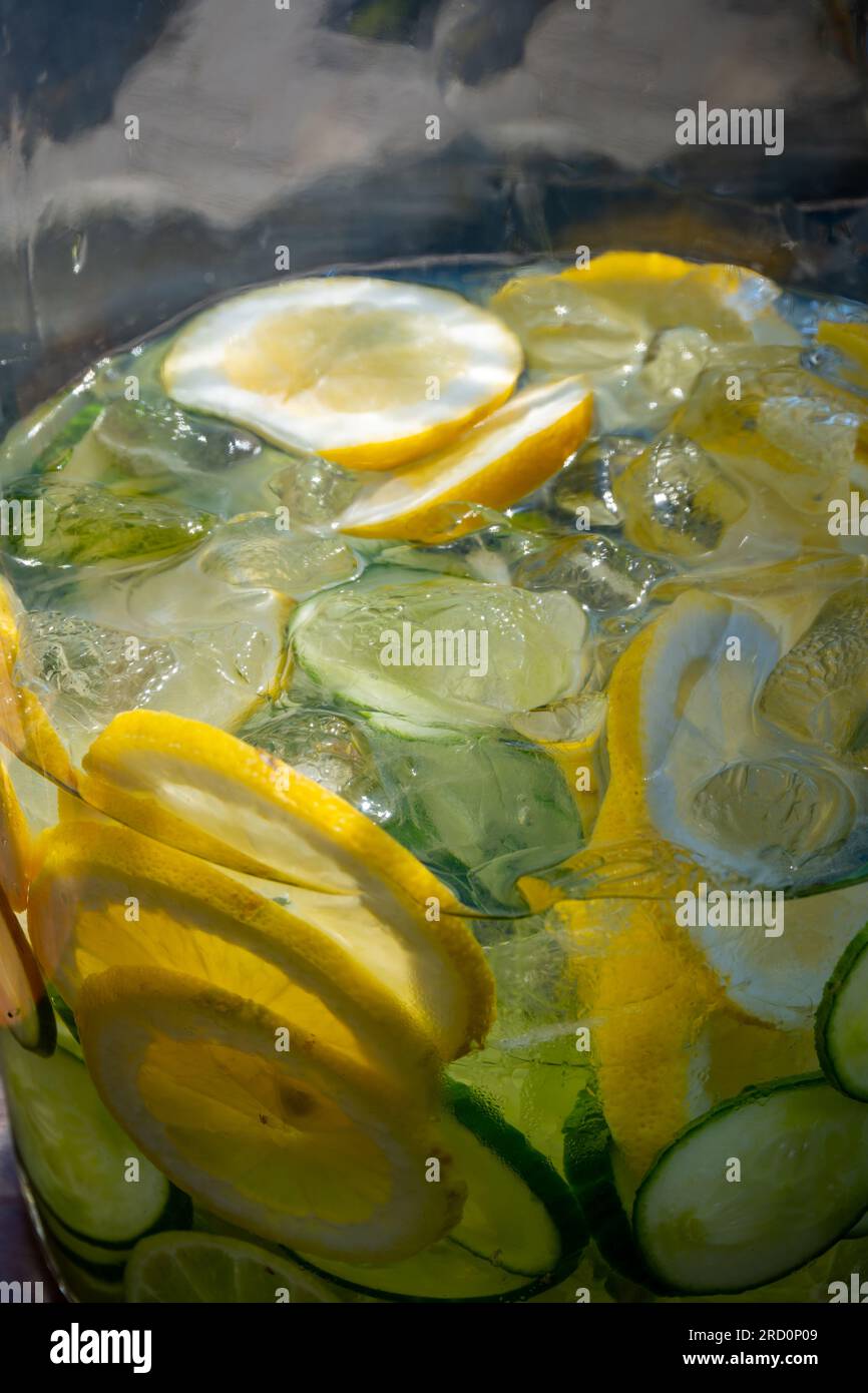 Big glass glass jar with tap filled with fresh healthy lemon lemonade ...
