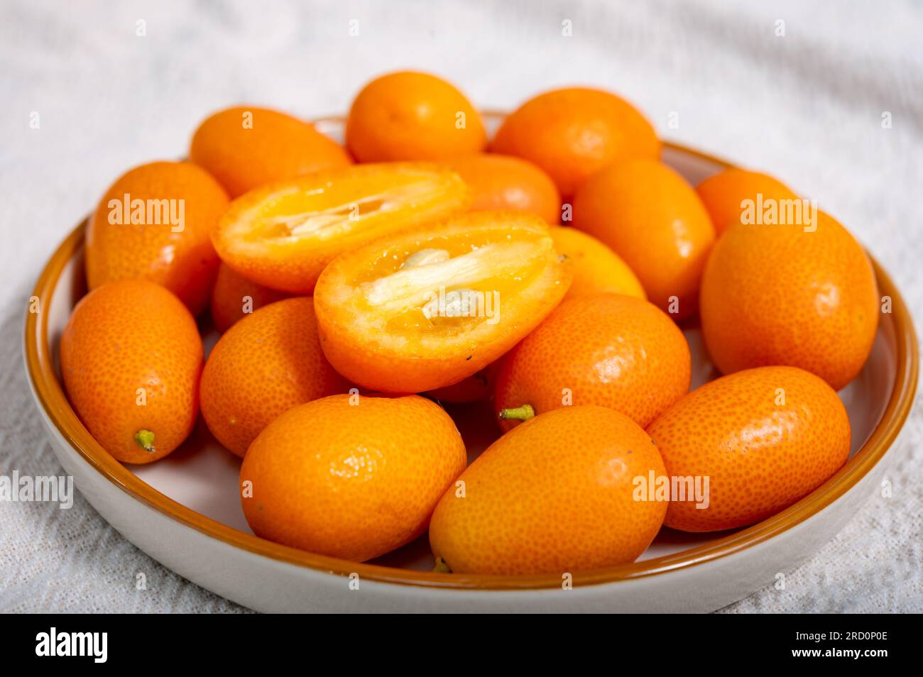 Delicious small citrus fruits orange kumquats close Stock Photo - Alamy