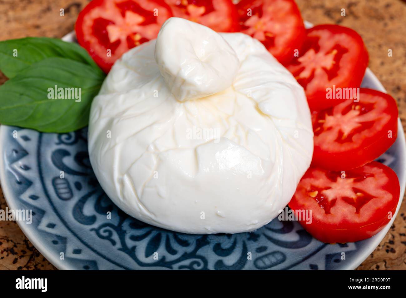 Fresh handmade soft Italian cheese from Puglia, white ball of burrata ...