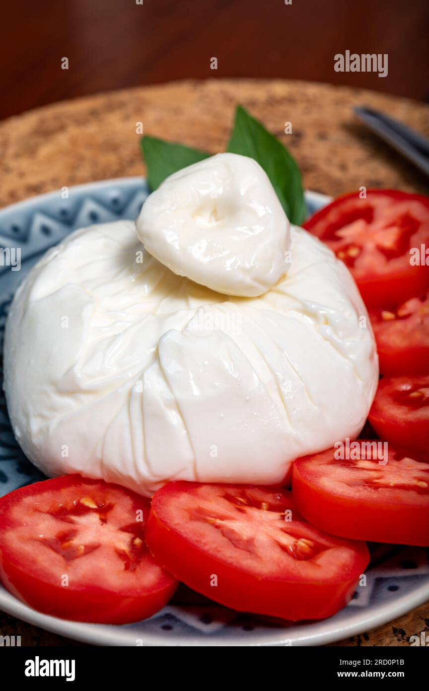 Fresh handmade soft Italian cheese from Puglia, white ball of burrata ...