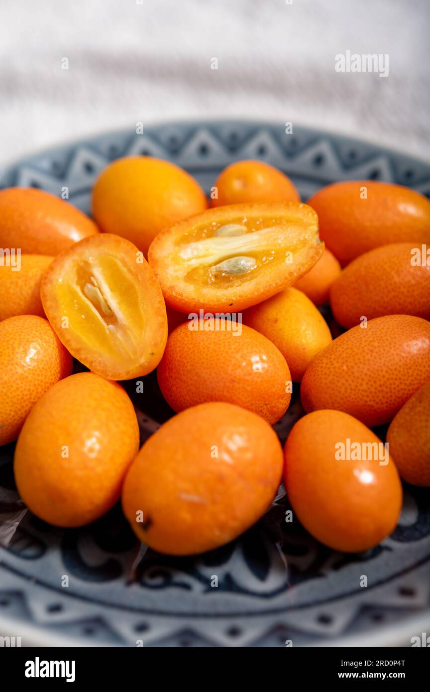 Delicious small citrus fruits orange kumquats close Stock Photo - Alamy