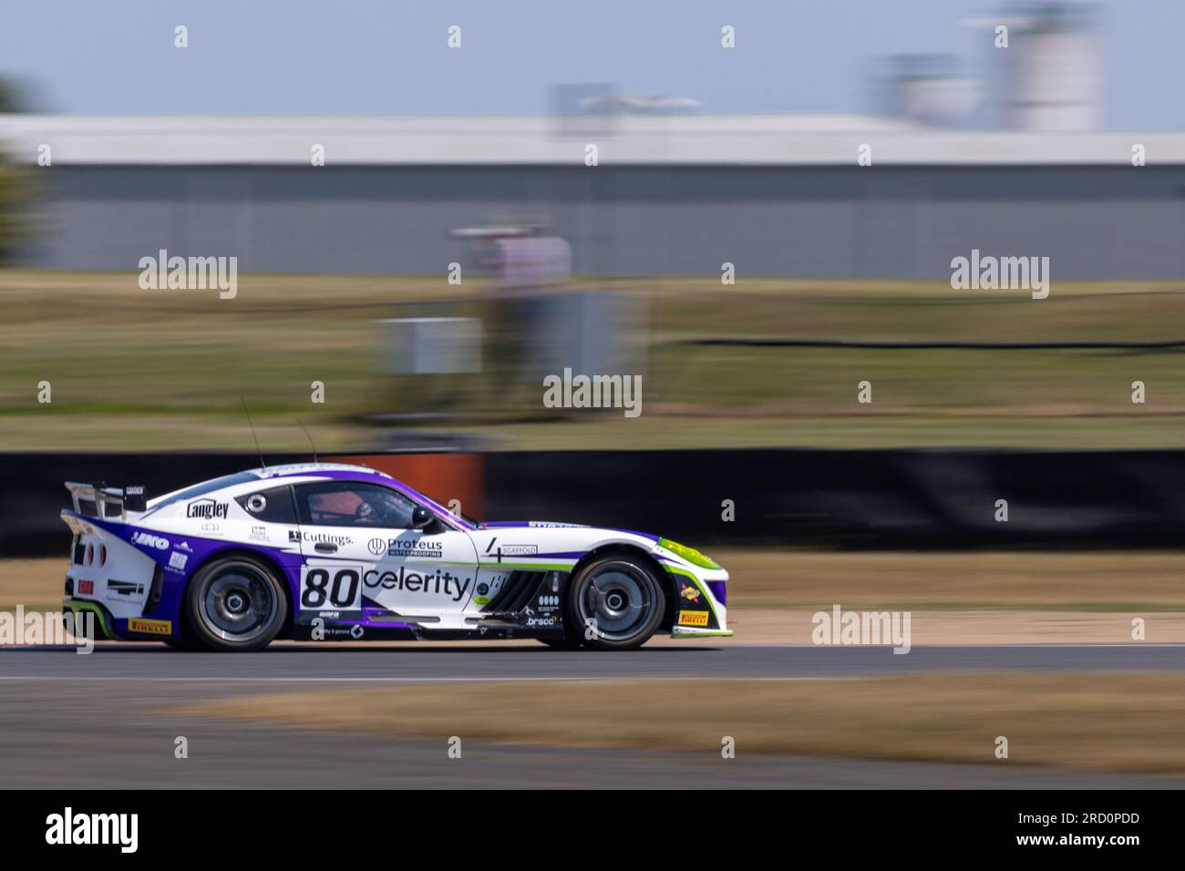 Panning photograph of sports racing car on Snetterton track Stock Photo ...
