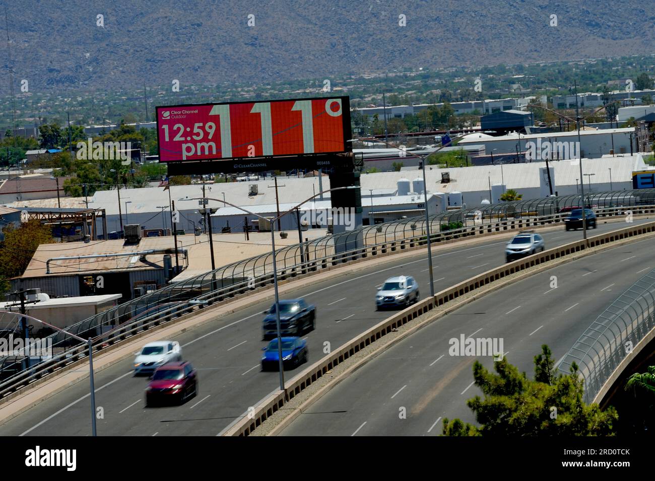 A digital billboard displays an unofficial temperature, Monday, July 17 ...