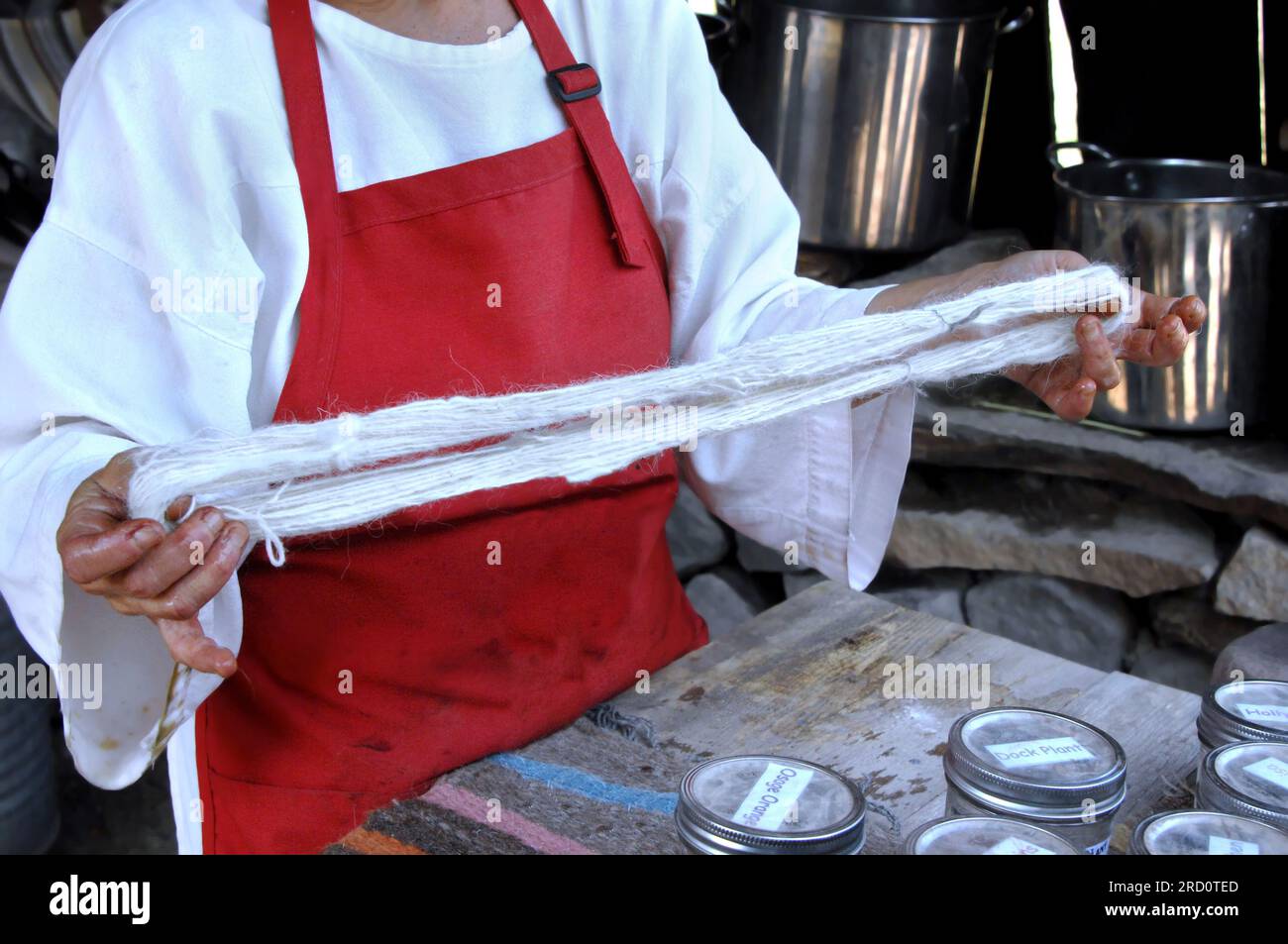 Old fashion method for making cloth, this yarner holds her homemade ...