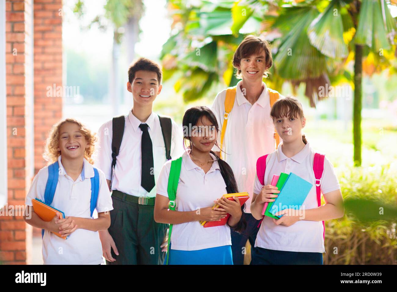 Kids go back to school. Interracial group of children of mixed age on ...