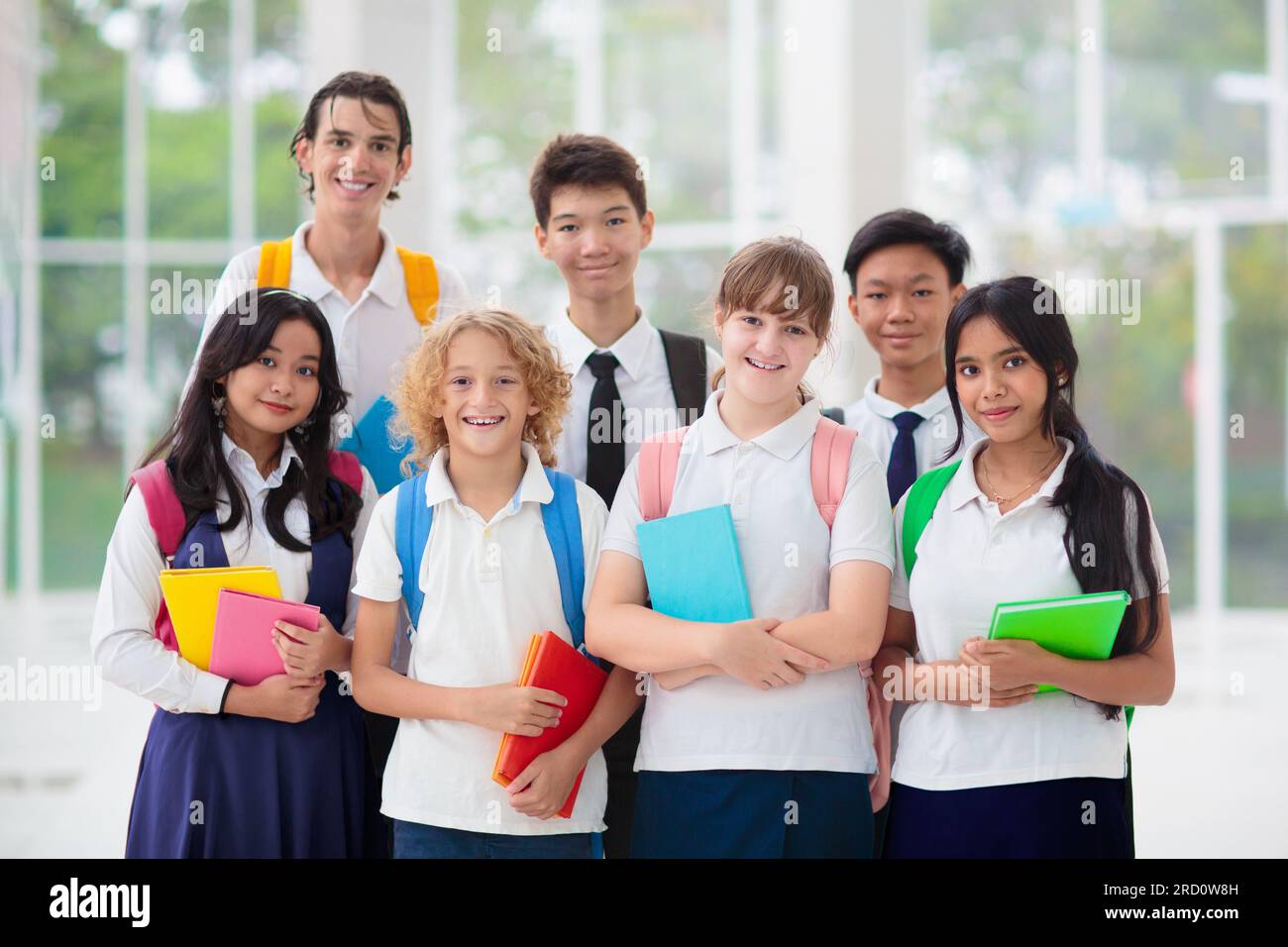 Kids go back to school. Interracial group of children of mixed age on ...
