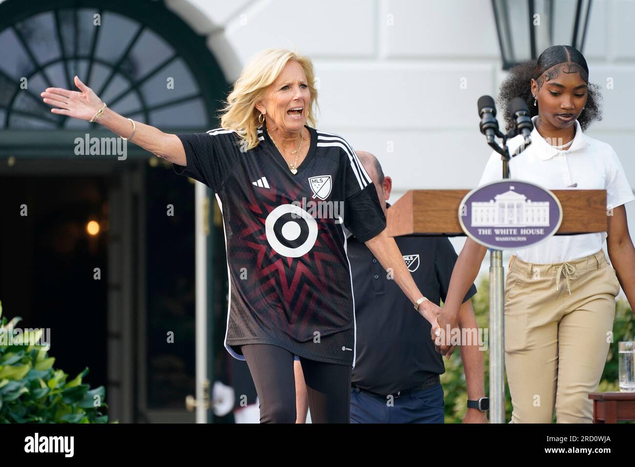 First lady Jill Biden gestures as she arrives to attend the Youth ...