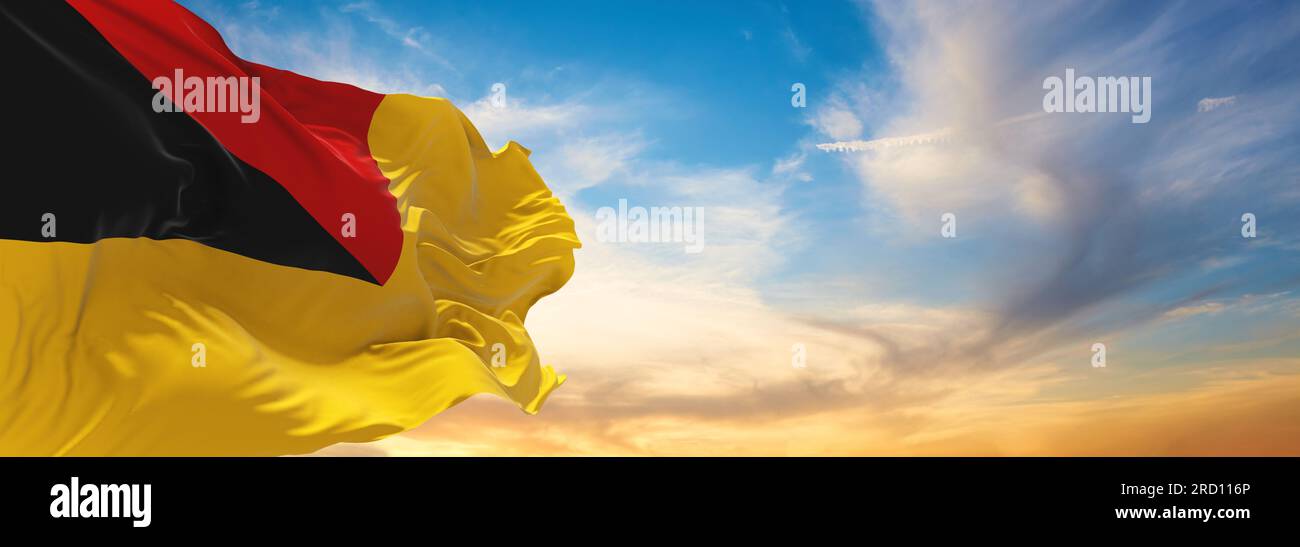 official flag of Negeri Sembilan Malaysia at cloudy sky background on ...