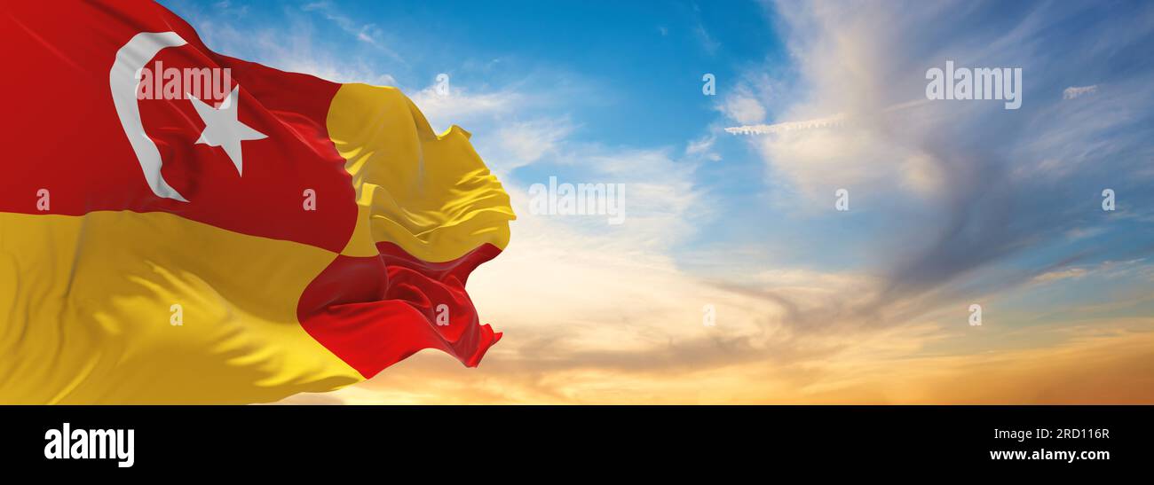 official flag of Selangor Malaysia at cloudy sky background on sunset ...