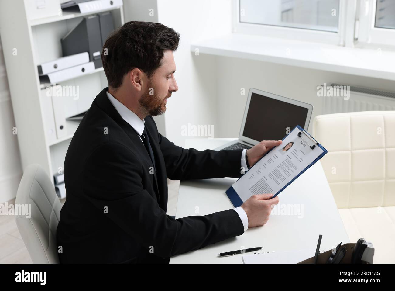 Human resources manager reading hi-res stock photography and images - Alamy