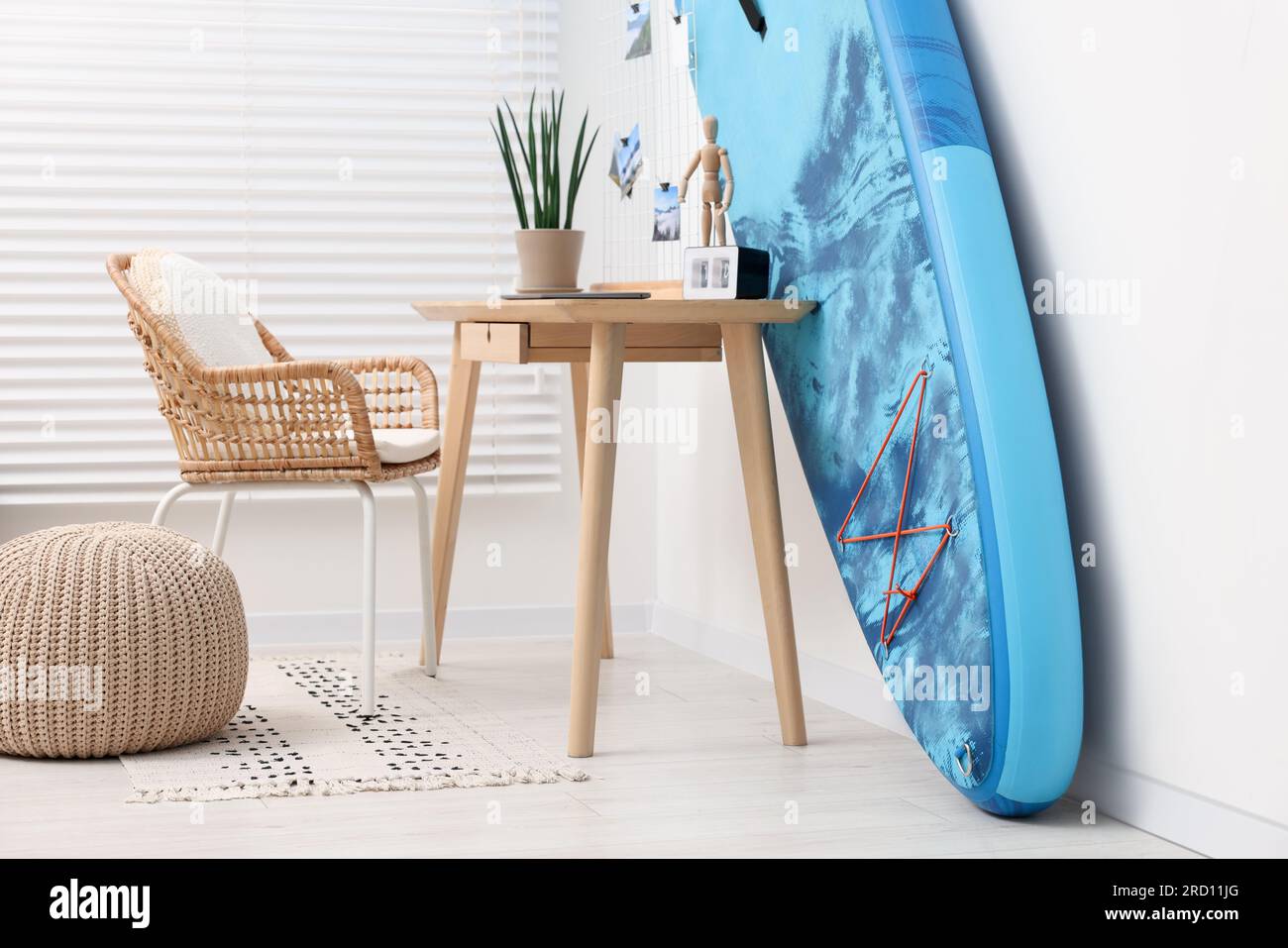 SUP board and workplace in room. Interior design Stock Photo - Alamy