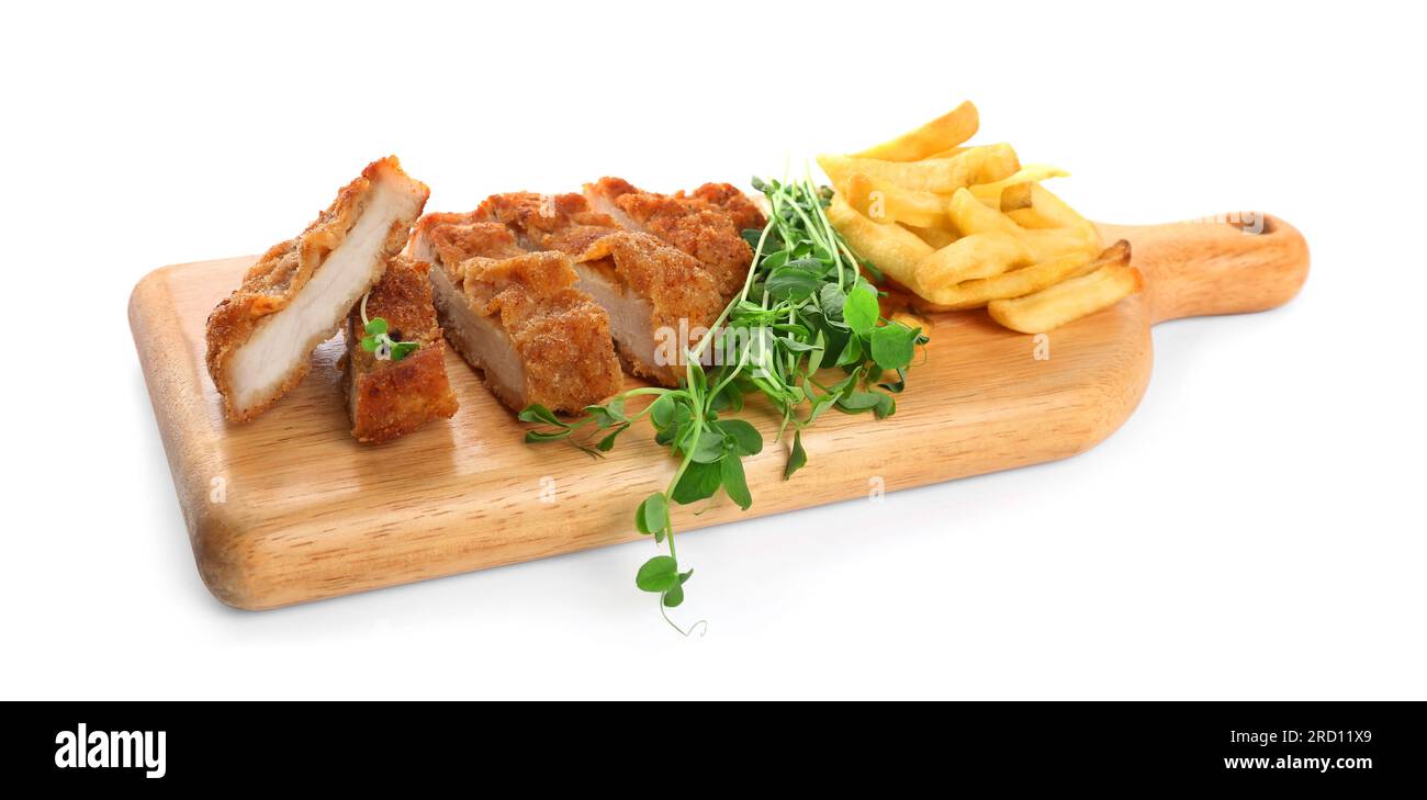 Delicious cut schnitzel with french fries and microgreens on white ...