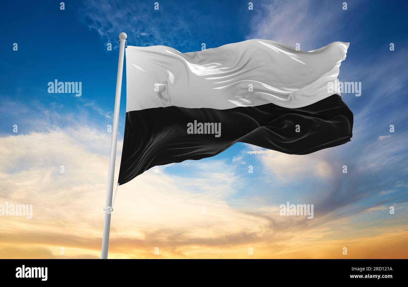 official flag of Pahang Malaysia at cloudy sky background on sunset ...