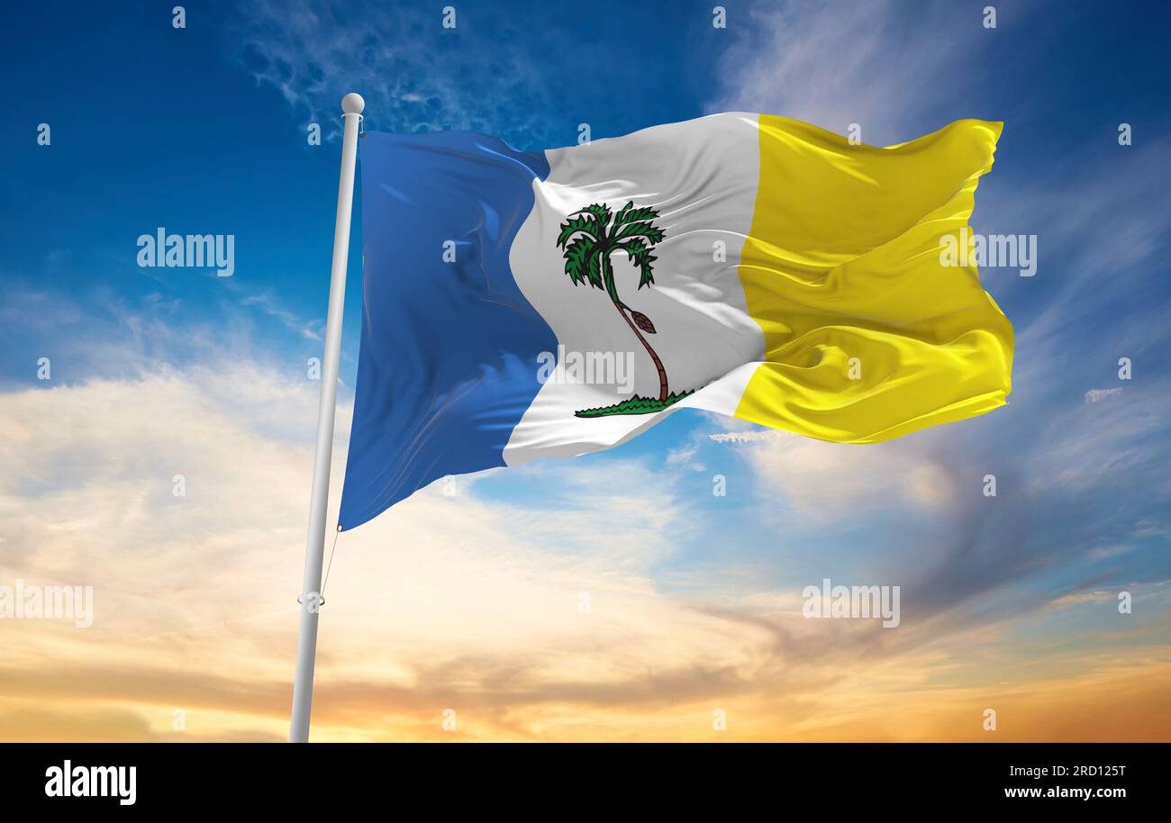 official flag of Penang Malaysia at cloudy sky background on sunset ...