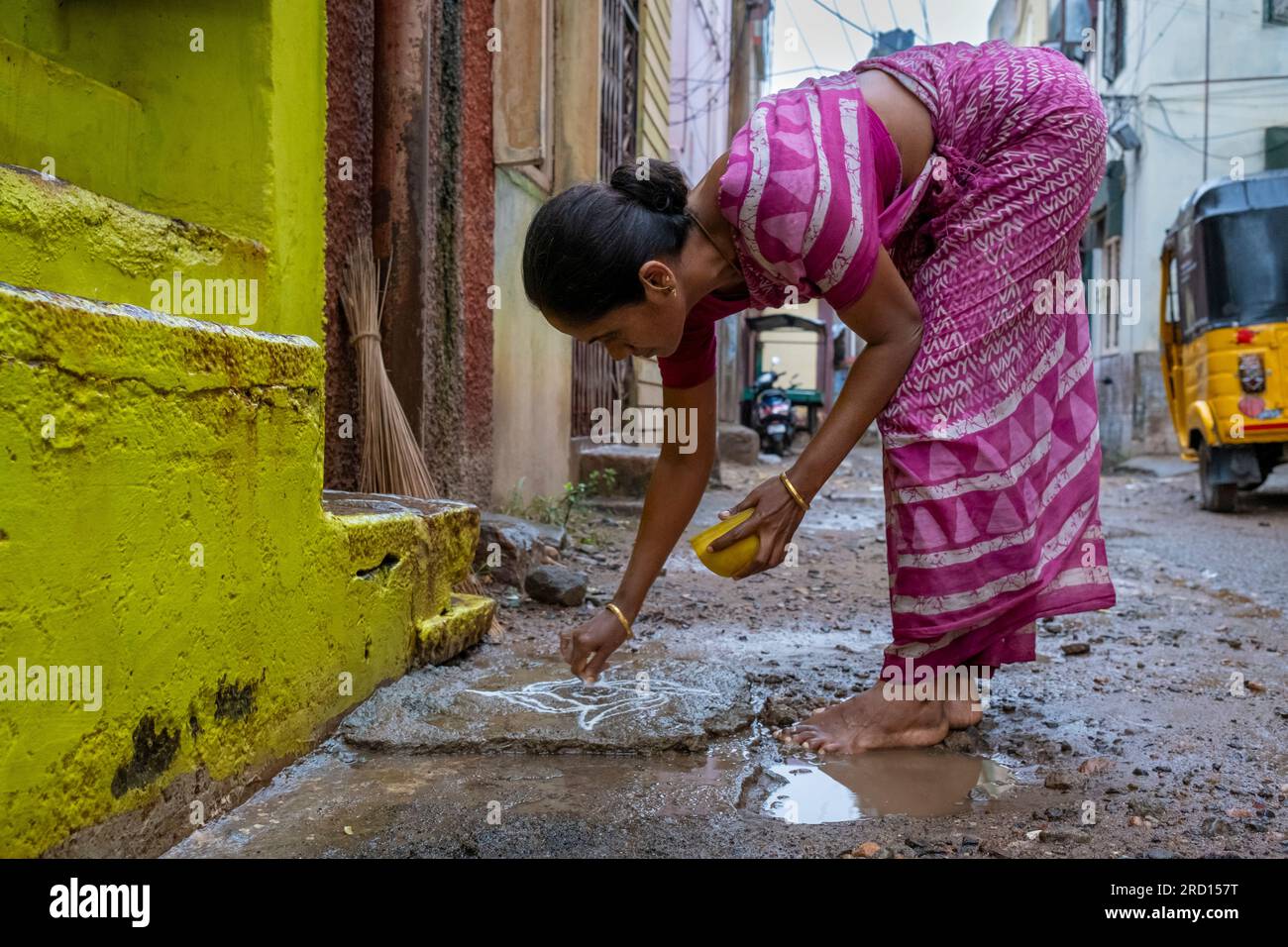 Woman creates mandala out of rice flour on her doorstep early morning ...