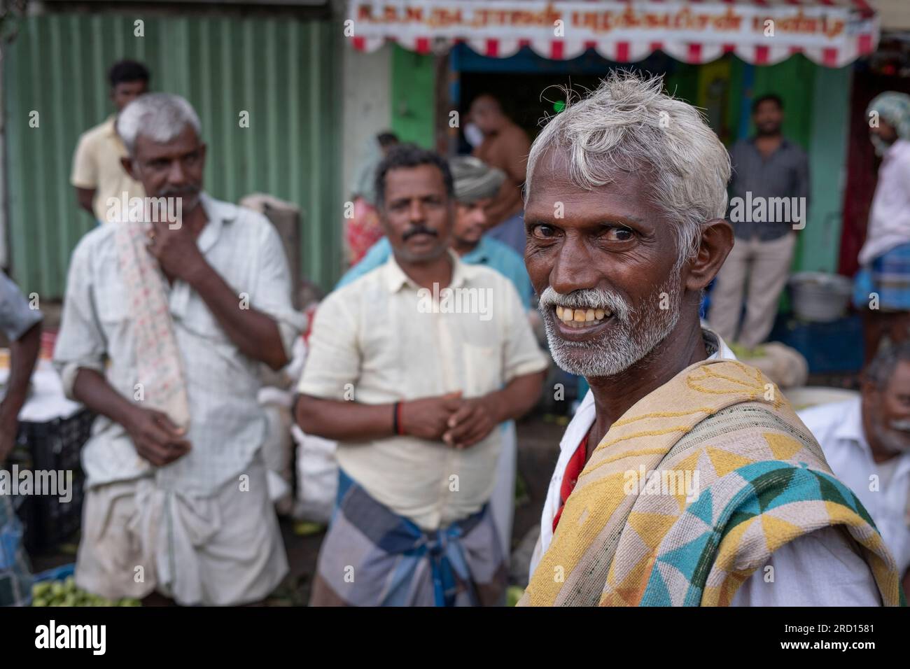 Manual laborers in early morning along back streets of Madurai, Tamil ...