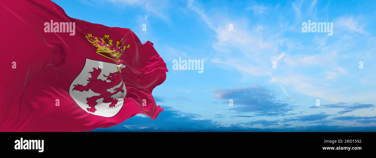 flag of Ibero-Romance peoples Leonese people at cloudy sky background ...