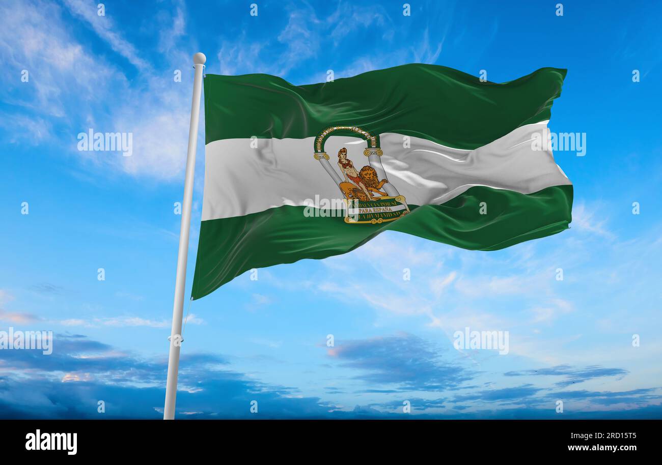 flag of Ibero-Romance peoples Andalusians at cloudy sky background ...