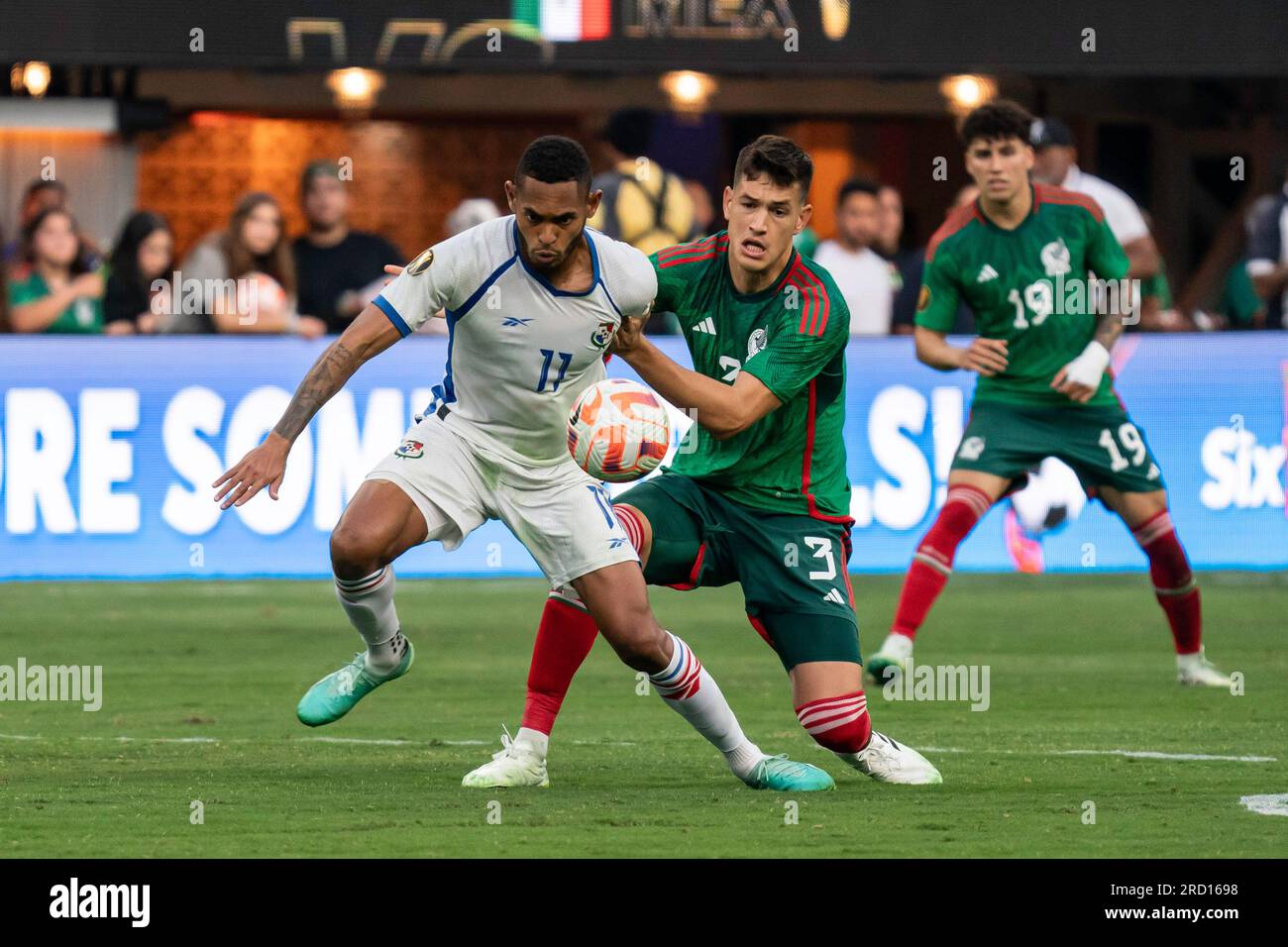 Panama forward Ismael Díaz (11) is defended by Mexico defender César ...