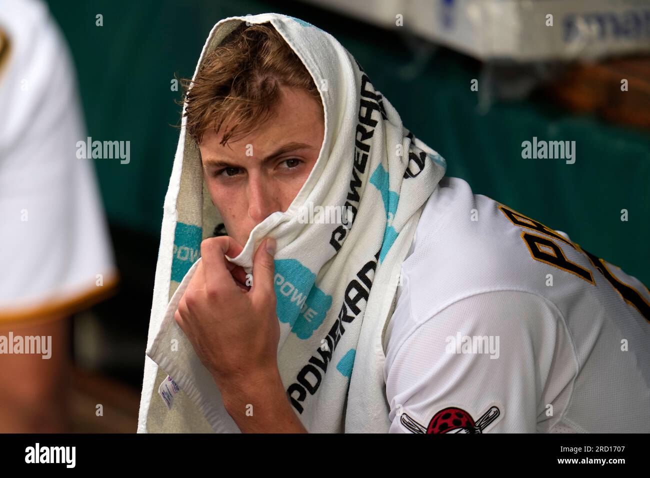 Pittsburgh Pirates starting pitcher Quinn Priester sits in the dugout ...