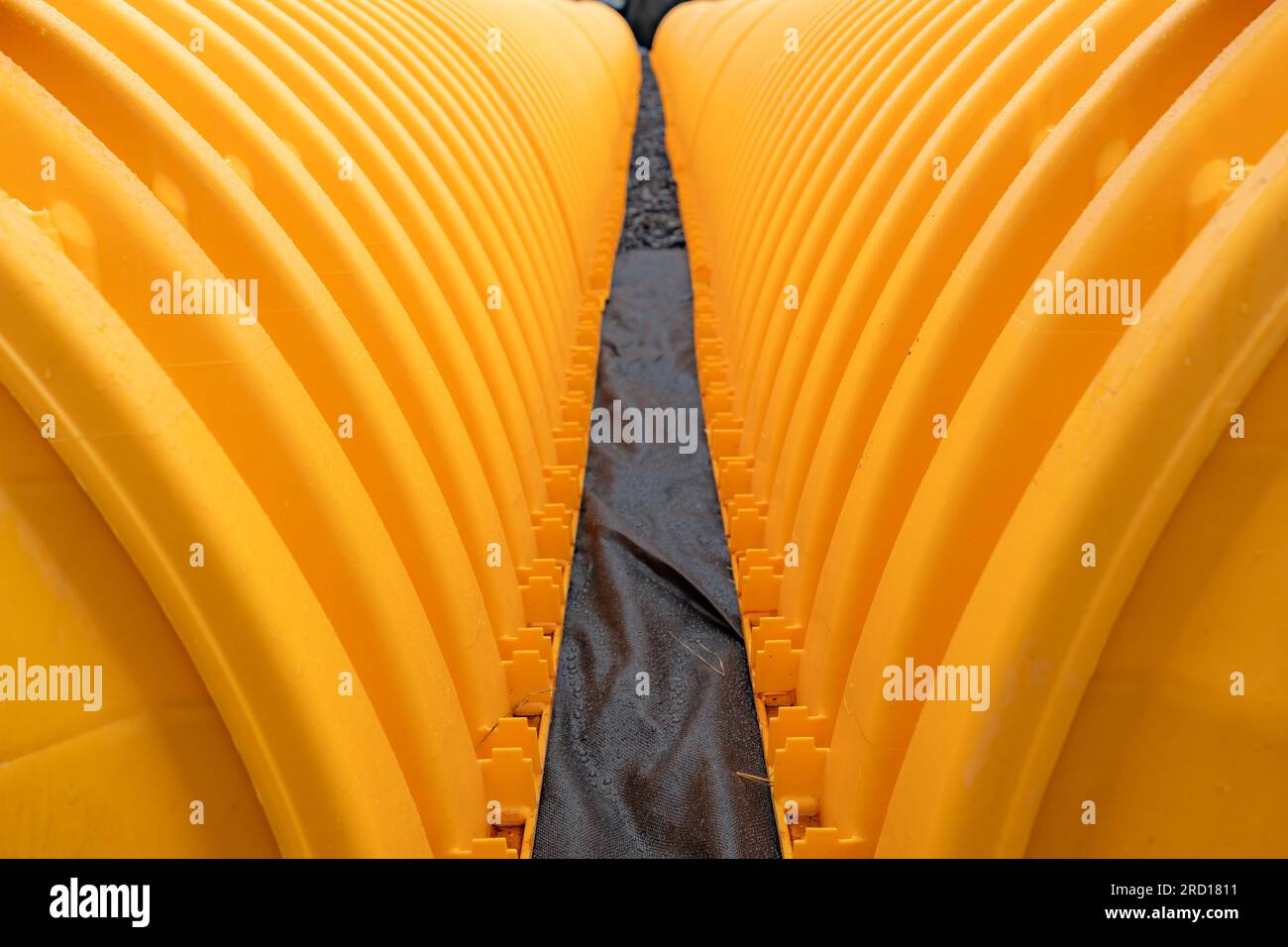 Yellow underground storm water detention mitigation units on a ...