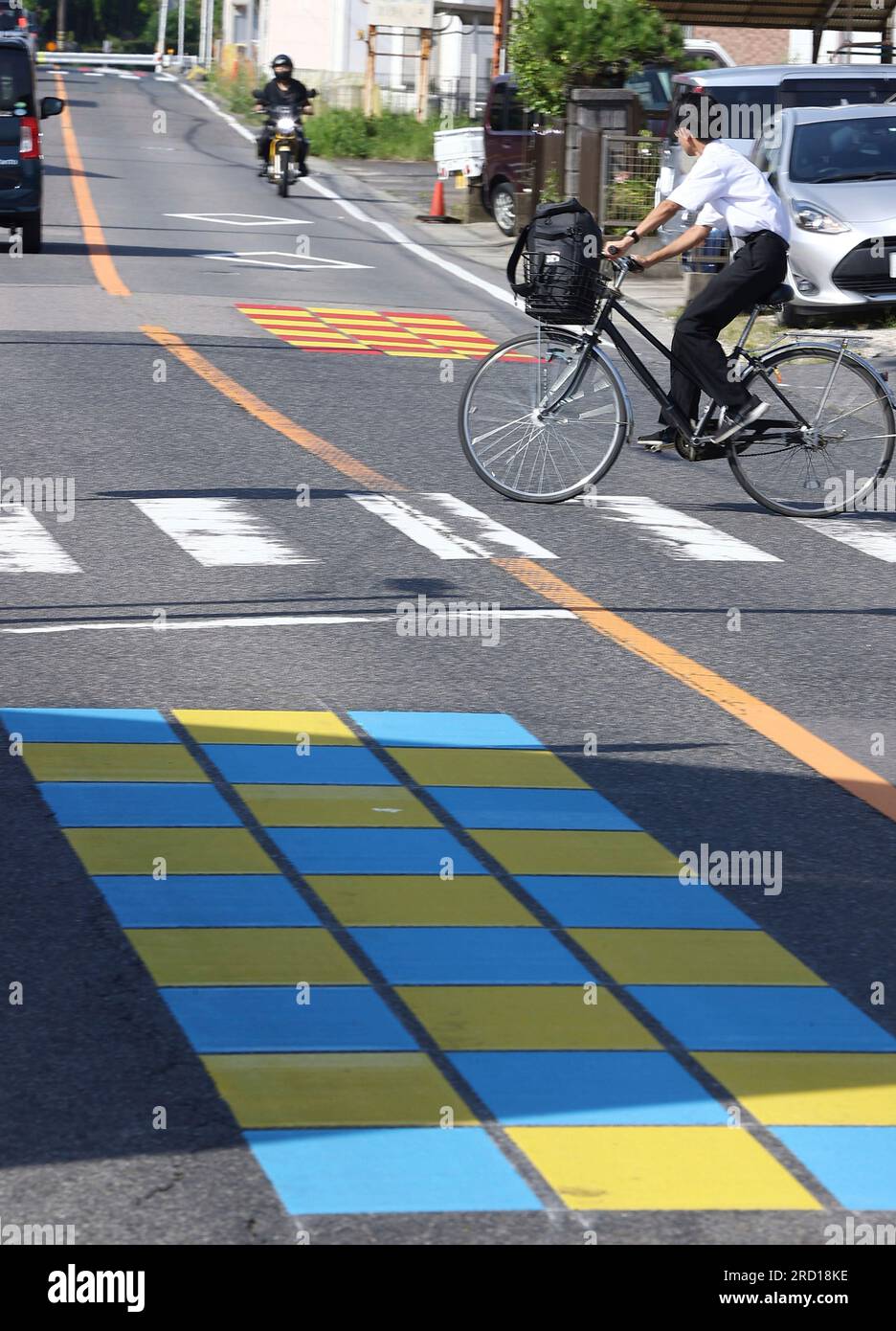 A new type of road sign is installed just this side a pedestrian ...