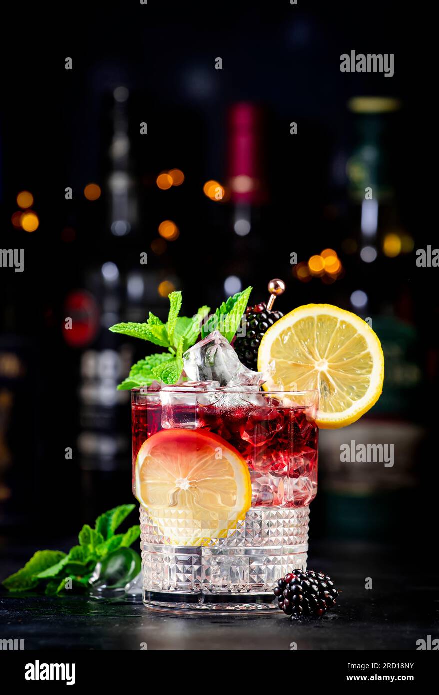 Bramble alcohol cocktail drink with dry gin, liqueur, syrup, lemon ...