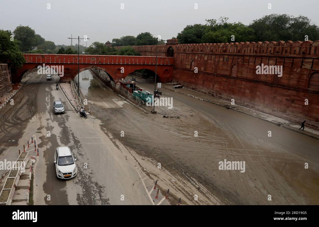 A view of the major road behind the Red Fort as floodwater of the swollen Yamuna River recede in ...