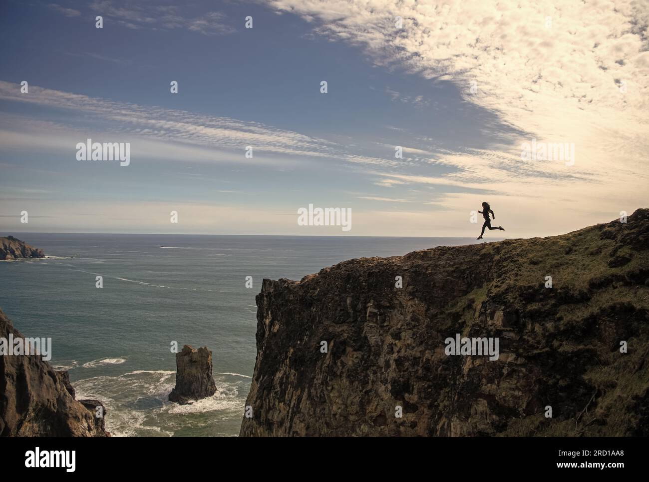 free woman runner running on the cliff. freedom and motivation Stock ...