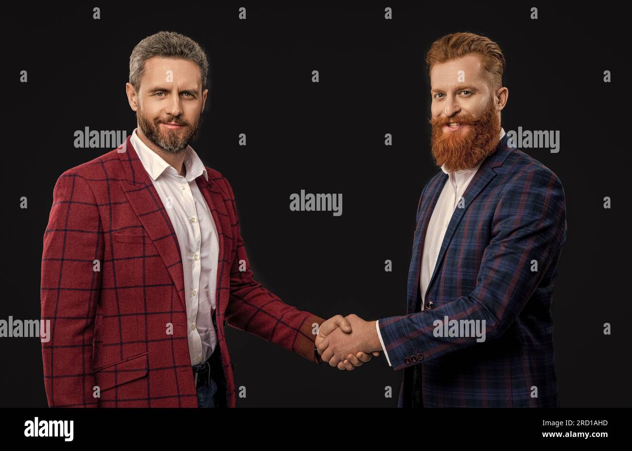 cheerful men deal with handshake on background. photo of men deal with ...