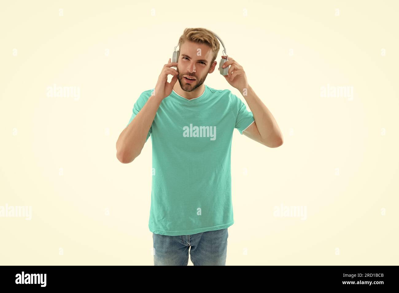 man in loud music headphones isolated on white. man in music headphones ...