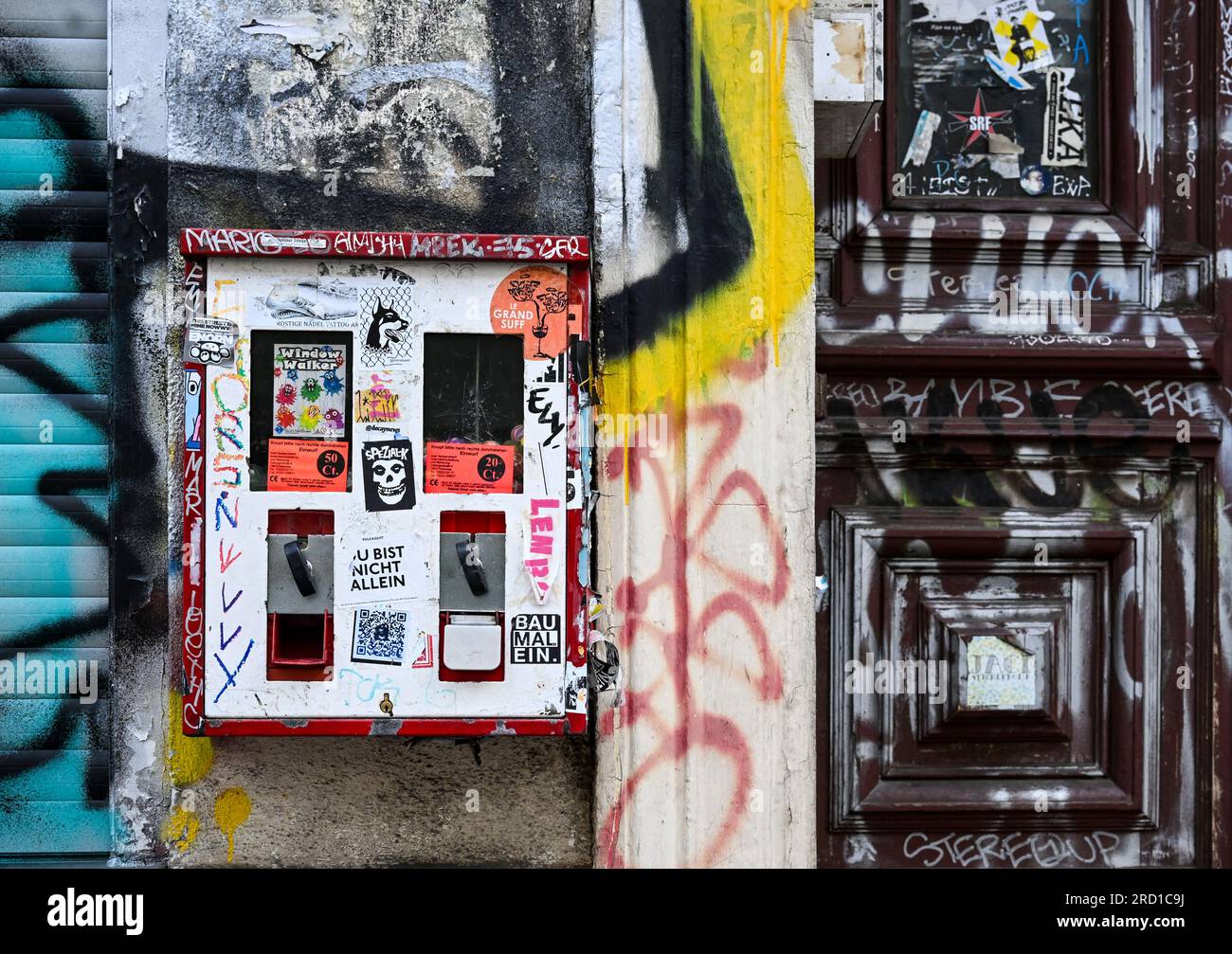 Berlin, Germany. 15th July, 2023. A chewing gum vending machine hangs ...