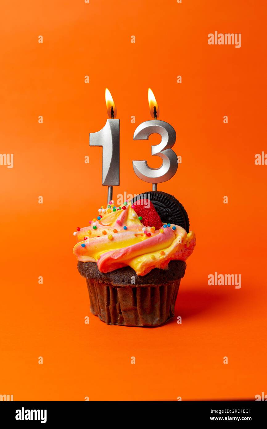 birthday cake with number 13 - cupcake on orange background with ...