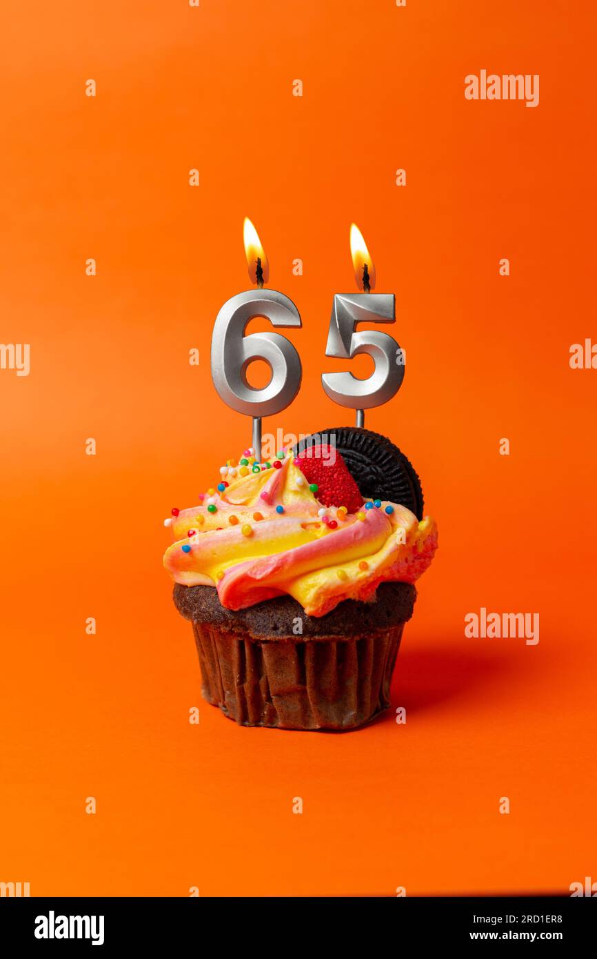birthday cake with number 65 - cupcake on orange background with ...