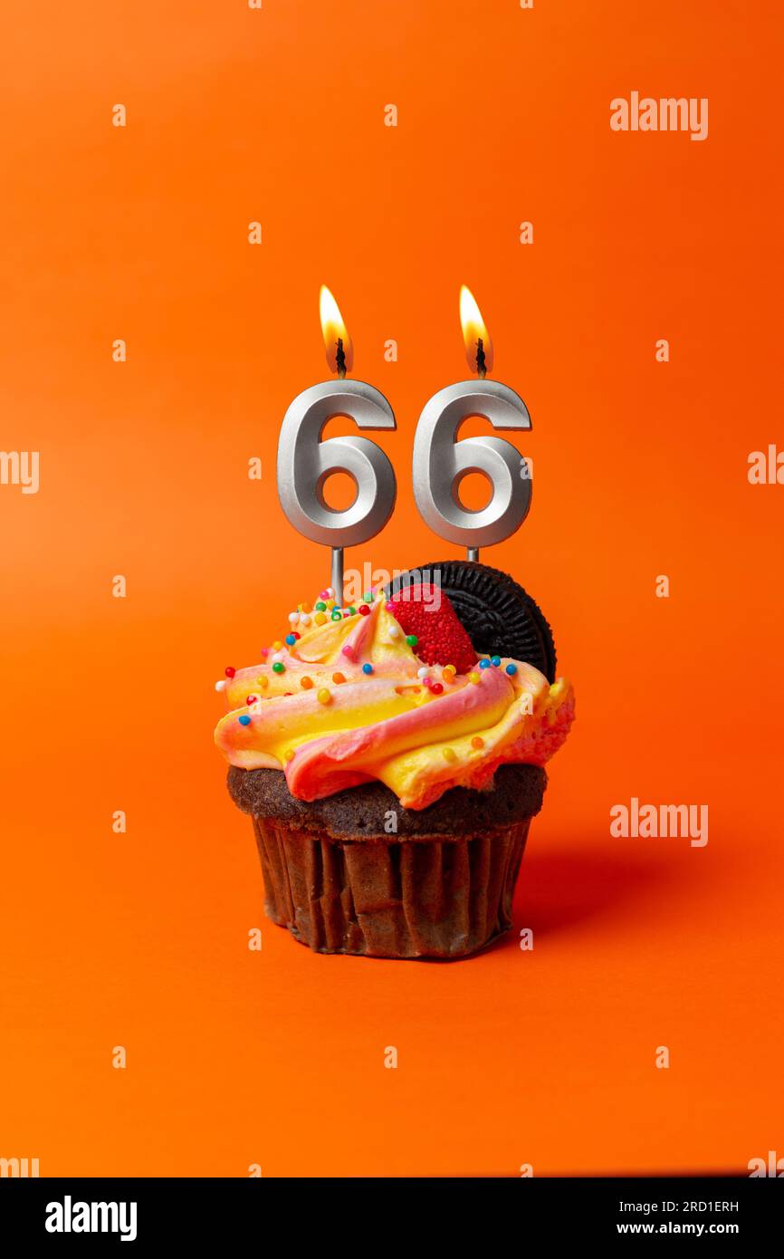 birthday cake with number 66 - cupcake on orange background with ...