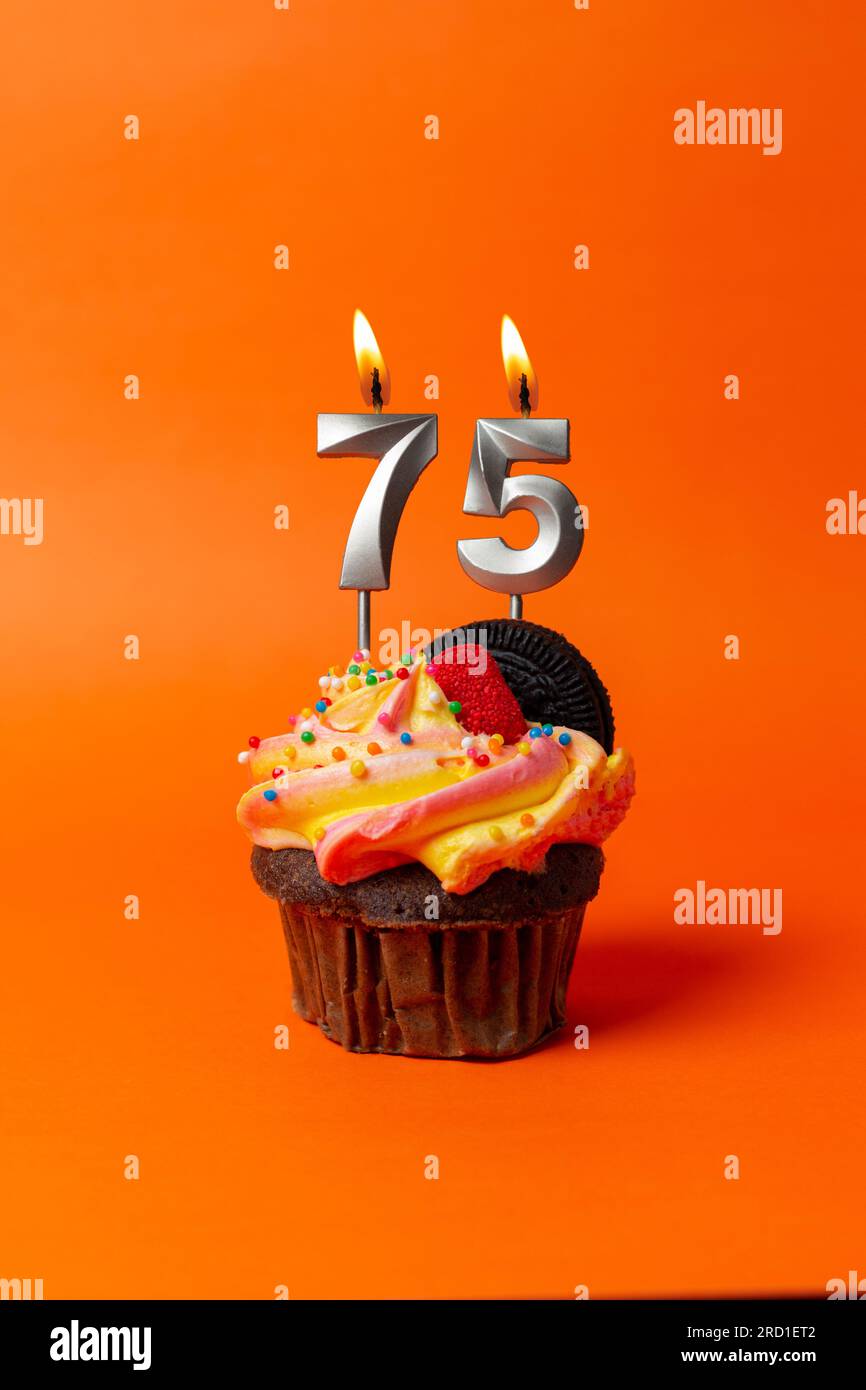birthday cake with number 75 - cupcake on orange background with ...