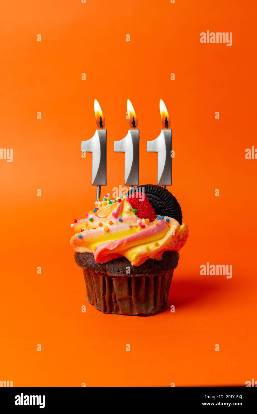 birthday cake with number 111 - cupcake on orange background with ...