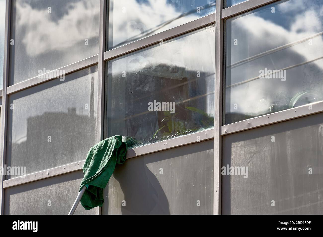 window washing, washing a street shop window Stock Photo - Alamy