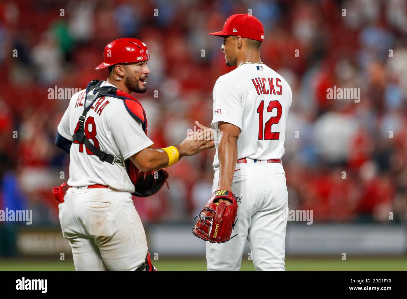 St. Louis Cardinals relief pitcher Jordan Hicks (12) high-fives catcher ...
