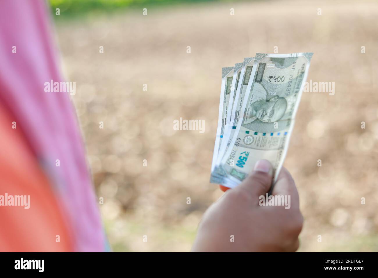 Happy Indian farmer, farmer holding indian rupees in hands, smart ...